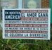 Yard Sign - En Nuestra America – Syracuse Cultural Workers